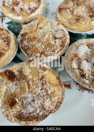 Frangipani mince pies on a festive plate Stock Photo - Alamy