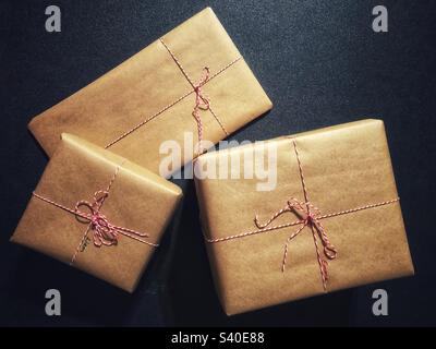 Brown paper packages tied up with string Stock Photo - Alamy
