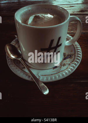 teabag with cup and saucer and silver spoon with letter T tile ...