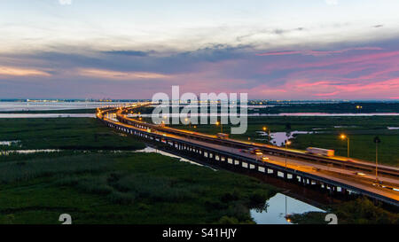 Mobile Bay and jubilee parkway bridge at sunset Stock Photo - Alamy
