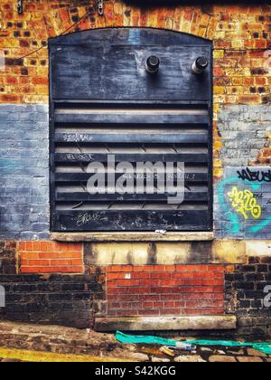 Patched up Brickwork in back alley Stock Photo - Alamy