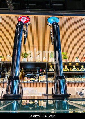 Beer taps and pumps in a bar at night Stock Photo - Alamy