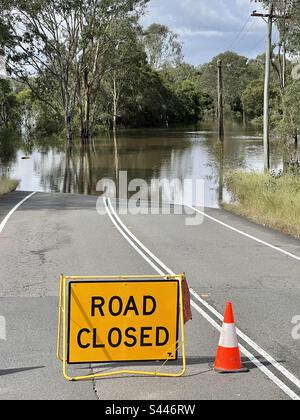 Road Closed road sign in front of flood water on Crossley Road during ...