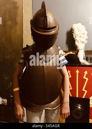 Child boy dressed as medieval knight / soldier training with spear ...