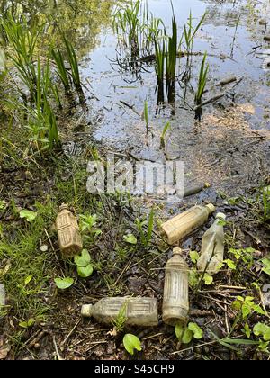 discarded plastic bottles pollute Lake Matka, a man-made lake in a ...