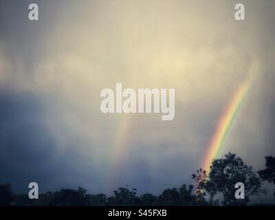A natural phenomenon of double rainbows seen over the Glorietta Clock ...