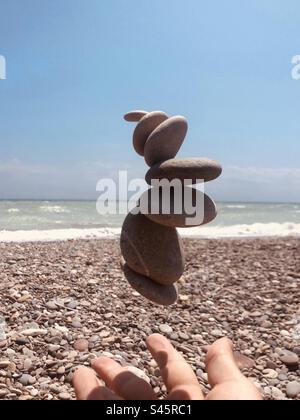 Balancing stones floating in midair Stock Photo - Alamy