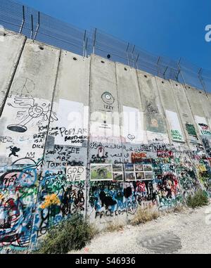 Murals decorating the Israeli security barrier in Bethlehem, Palestine ...