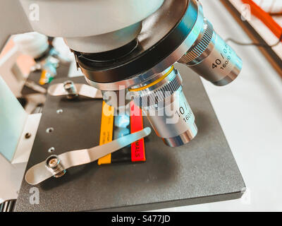 A microscope set up in a school science lab to look at a sample Stock ...