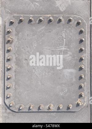 gray metal plates fastened together with rows of rivets Stock Photo - Alamy