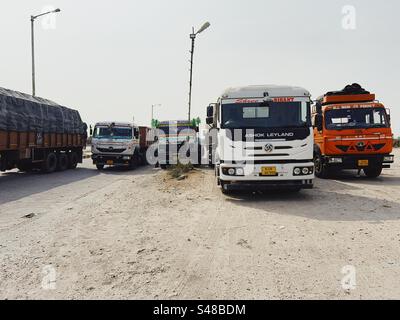 Cargo trucks parked on an Indian National Highway Stock Photo - Alamy