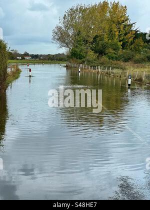 Water flooded the road. Spring flood of the river Stock Photo - Alamy