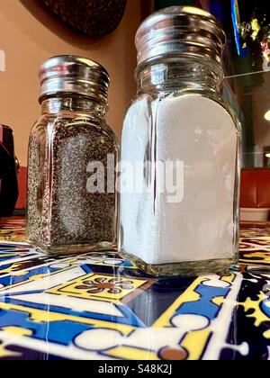 Salt and pepper shakers in a Mexican restaurant Stock Photo - Alamy