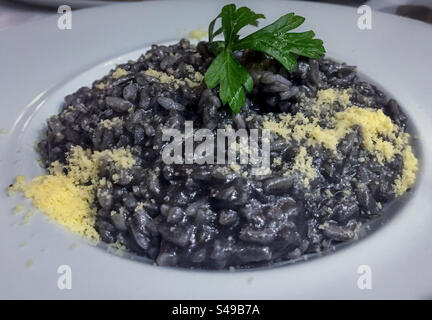 Squid ink risotto Stock Photo - Alamy