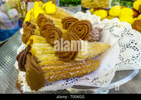 Valencia churros, cakes, sweets sold during the festival Las Fallas ...