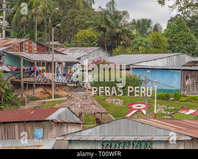 Pebas, Peru - December 04 , 2018: View of village on the bank of the ...