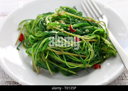 sauteed agretti, italian food Stock Photo - Alamy