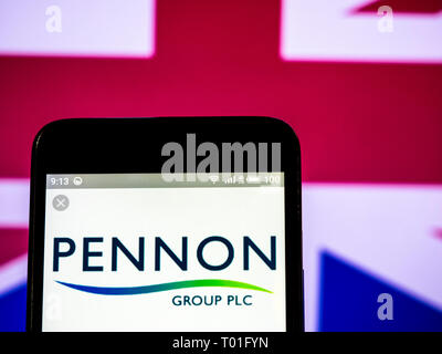 The Pennon Group logo is seen on an LED screen in the background while ...