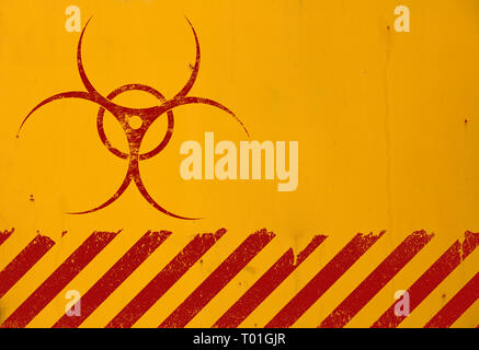 Dark red biohazard warning sign painted over grunge yellow background ...