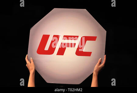 A ring girl holds up a UFC round number sign during UFC 286 at 02 Arena ...