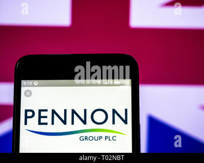 The Pennon Group logo is seen on an LED screen in the background while ...