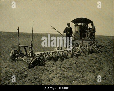 . Dry-farming: . A GASOLENE-TRACTION PLOWING OUTFIT AT WORK ON A MOO ...