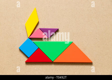 Tangram puzzle in rabbit shape on old white wood background Stock Photo ...