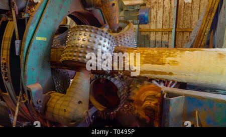 Sawmill log debarker Stock Photo - Alamy