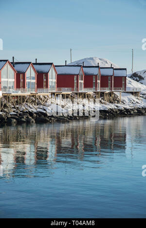 Traditional red rorbuer cabins in the fishing village of Reine, Lofoten ...