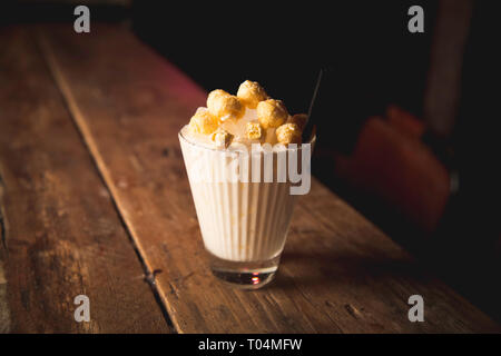 Creamy popcorn cocktail on bar Stock Photo - Alamy