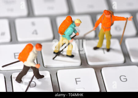 Hikers walking across a computer keyboard Stock Photo - Alamy
