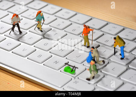 Hikers walking across a computer keyboard Stock Photo - Alamy