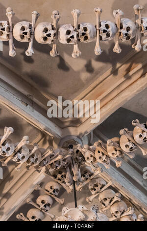 Human remains, skulls and bones arranged geometrically in a crypt, San ...