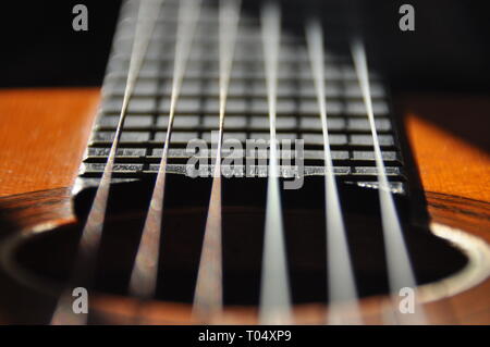 Classical guitar. Issuing a stringed instrument sounds. Fretboard ...