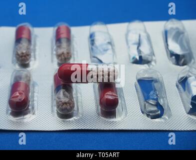 The drug in capsules. Capsules lie in plastic transparent packaging ...