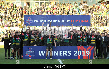 Northampton Saints players celebrate with the trophy on the pitch after ...