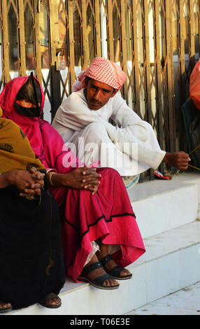 An Omani Bedouin woman wearing a traditional Batoola face covering ...