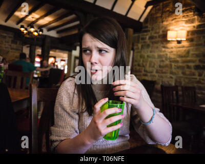 Millennial / Teenage girl in a pub Stock Photo - Alamy