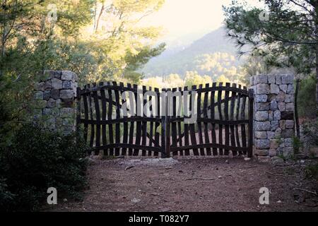 Closed wooden gate in a traditional Scandinavian roundpole fence ...