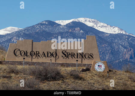 Welcome sign to Colorado Springs, Colorado with snow covered Pikes Peak ...