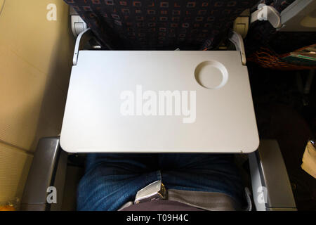 Plane / aeroplane passenger seat tray table in the full down position ...