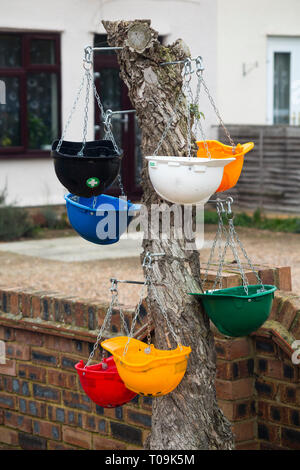 Several hanging baskets together, to decorate / use / disguise a dead ...