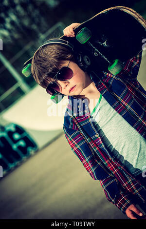cool looking skater boy, with sunglasses and headphone vintage effect ...