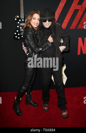 HOLLYWOOD, CA - MARCH 18: Seraina Schönenberger (L) and Mick Mars ...