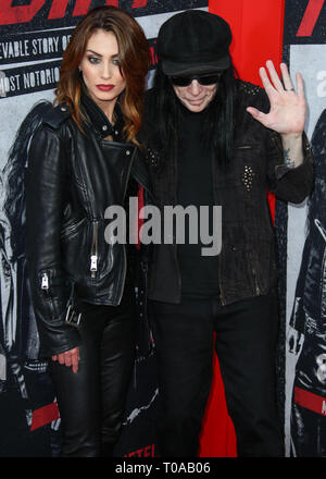 HOLLYWOOD, CA - MARCH 18: Seraina Schönenberger (L) and Mick Mars ...