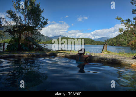 Enjoying hot springs overlooking the fiord, Termas de Puyuhuapi ...
