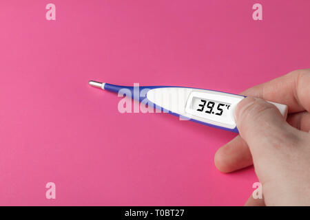 39.5 degrees Celsius on clinical electronic thermometer on white ...