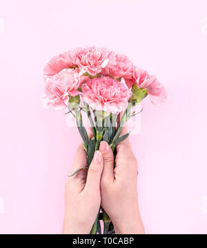 Woman giving bunch of elegance blooming baby pink color tender ...