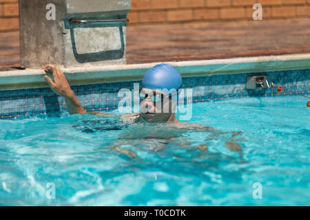 Young Caucasian male swimmer standing in swimming pool Stock Photo - Alamy
