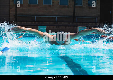 Young man swimmer with swim goggle swimming at swimming pool Stock ...
